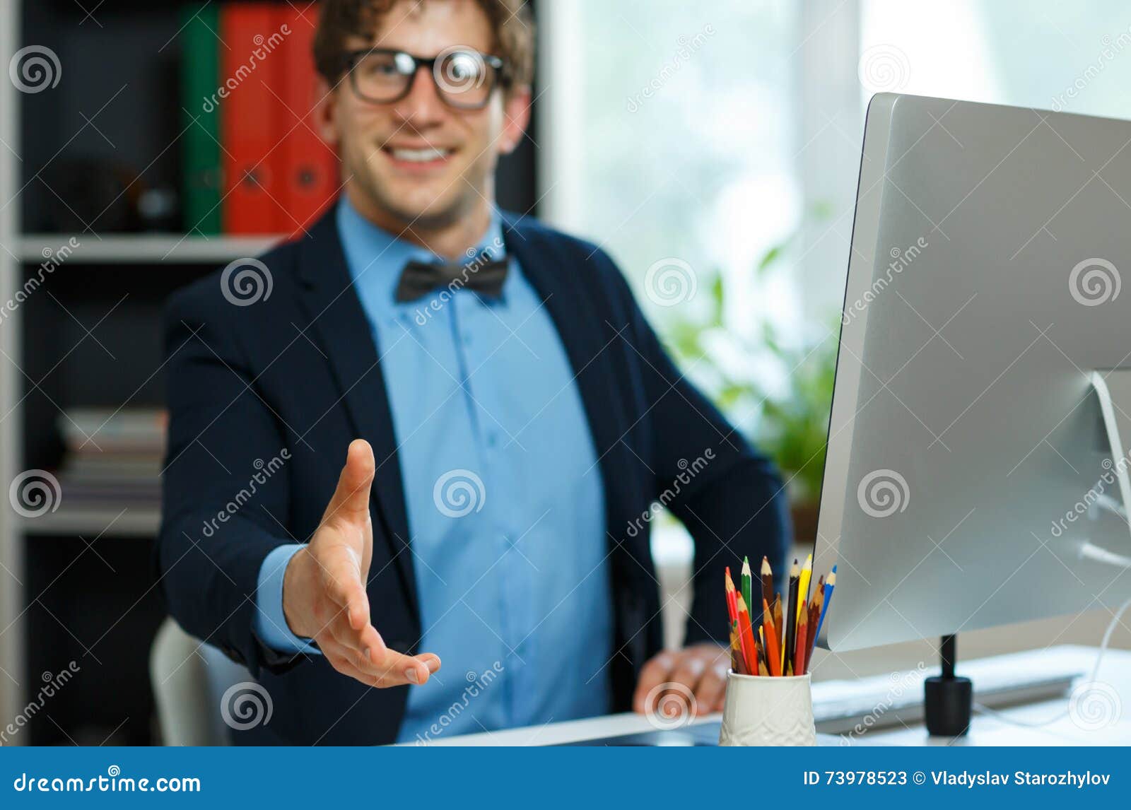 Young Business Man with Arm Extended To Handshake Stock Image - Image ...