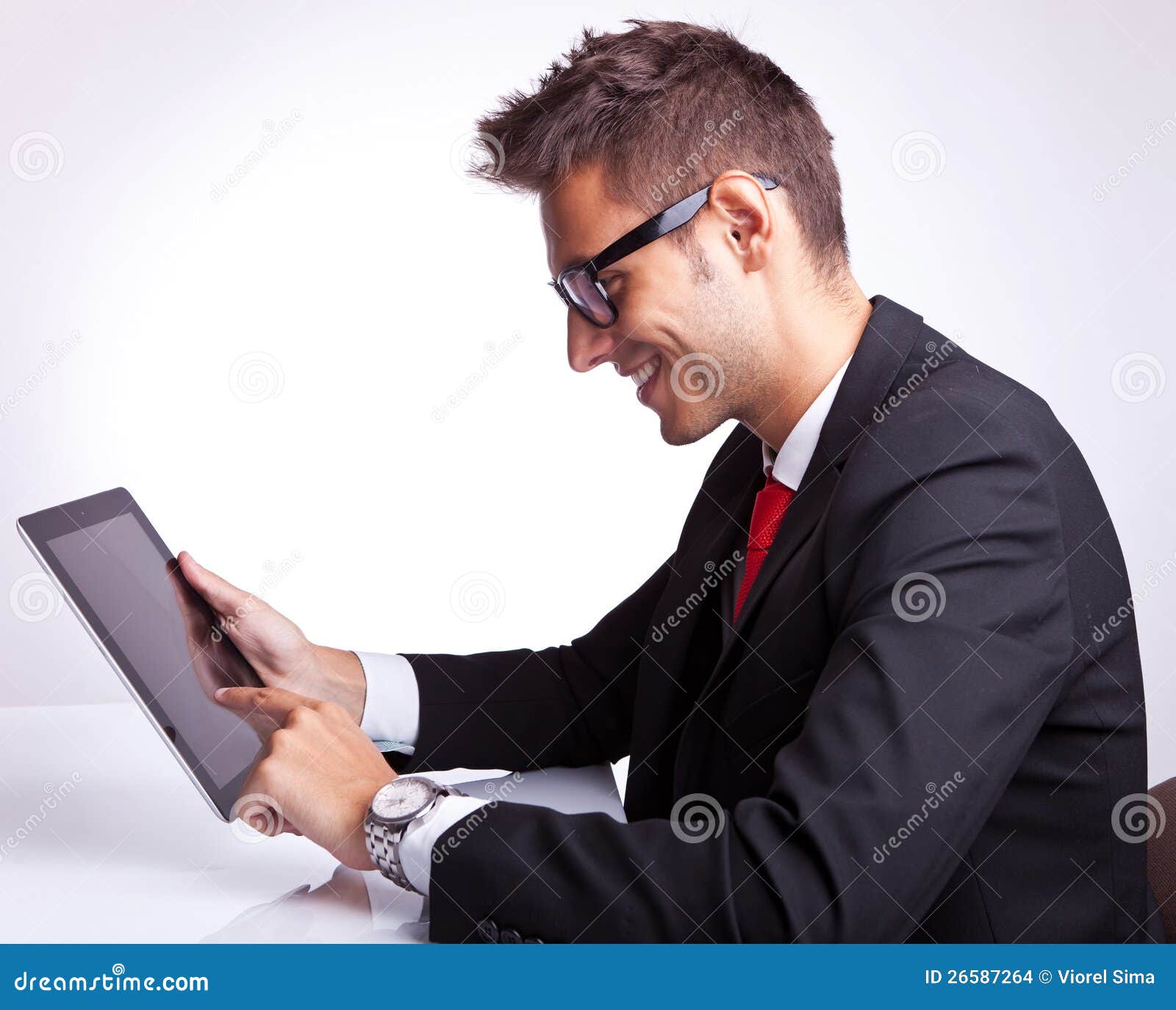 Young Business Man Browsing on His Tablet Pad Stock Photo - Image of ...
