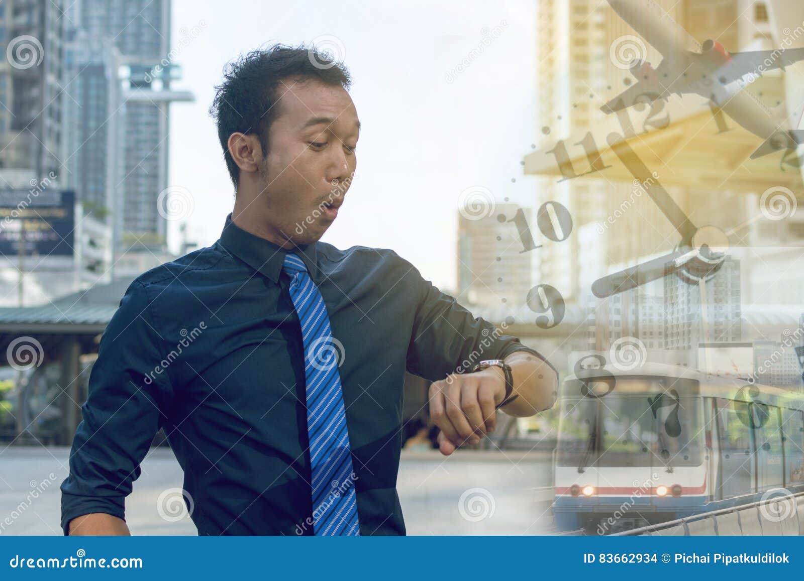 Young Business Man Checking the Time on His Watch. Time Planes T Stock ...