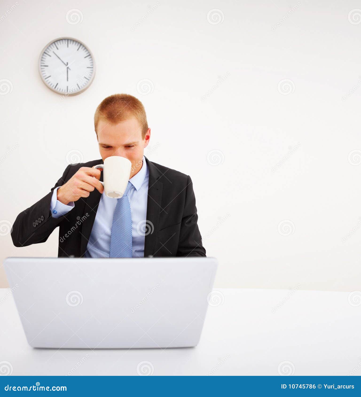Young Business Man Drinking Coffee while Working Stock Photo - Image of ...