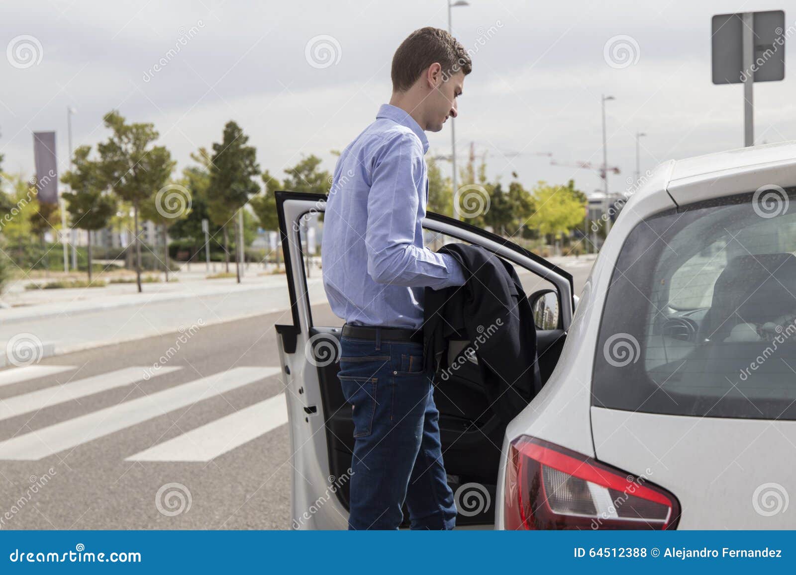 Young Business Man Getting Inside White Car Stock Photo - Image of road ...