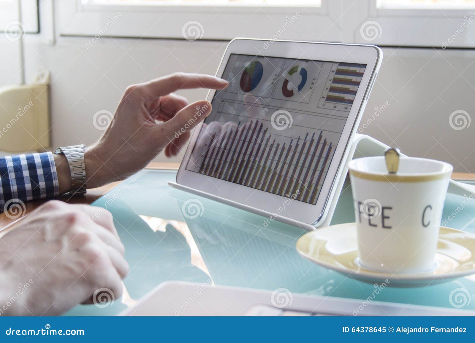 Young Business Man Hands Checking Data on Tablet Screen and Coffee on ...