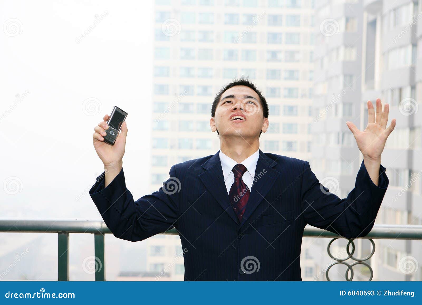 Young Business Man Holding Mobile Phone Stock Image - Image of building ...