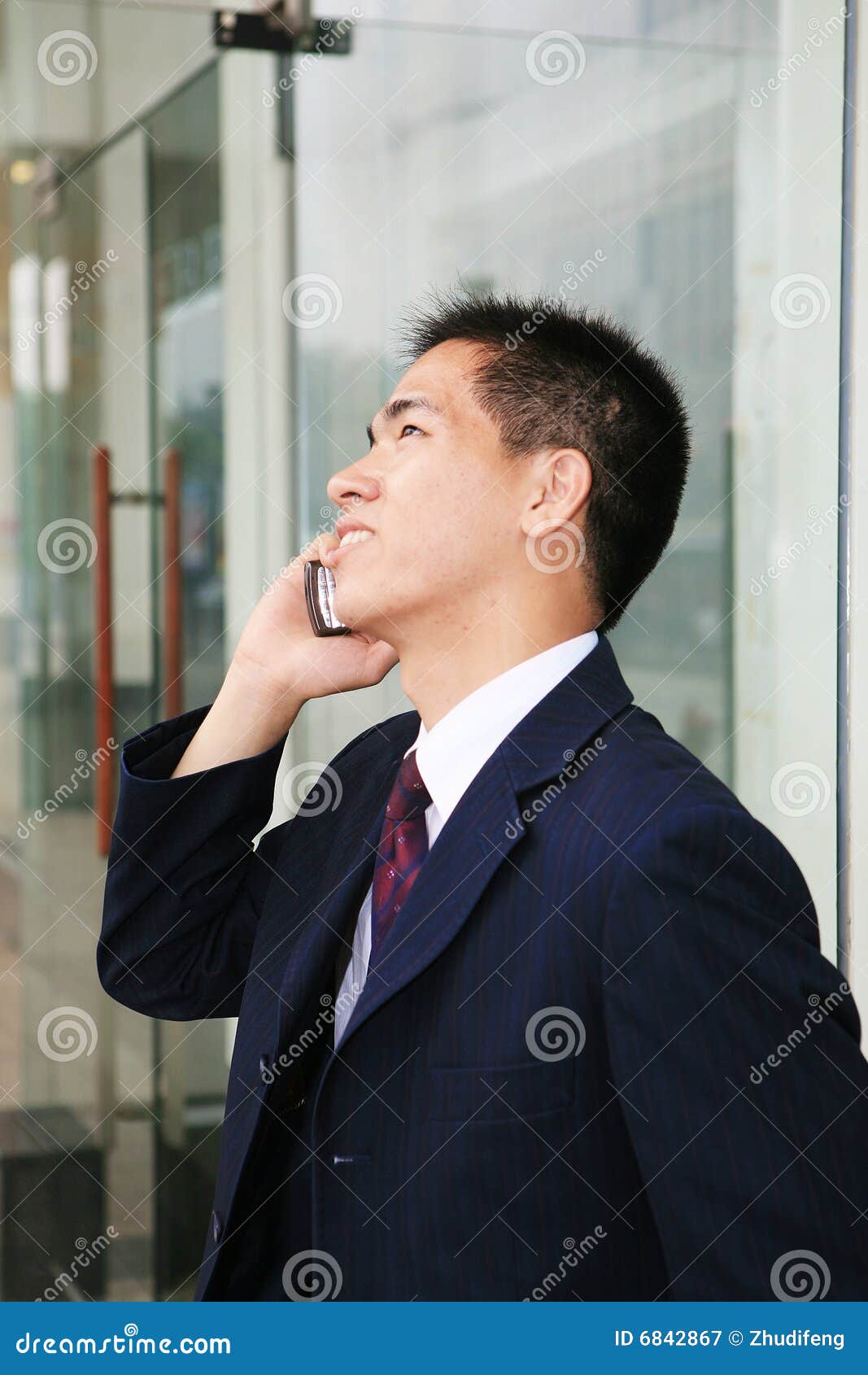 Young Business Man Holding Mobile Phone Stock Image - Image of company ...