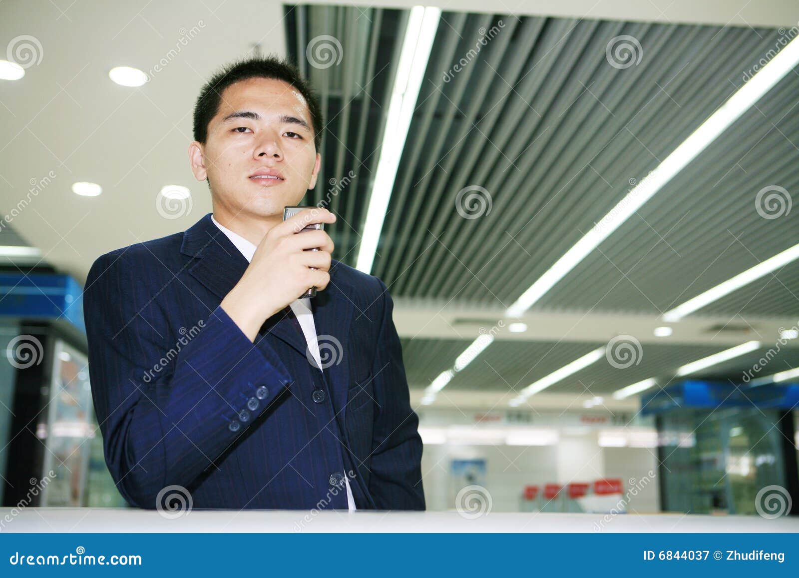 Young Business Man Holding Mobile Phone Stock Image - Image of male ...