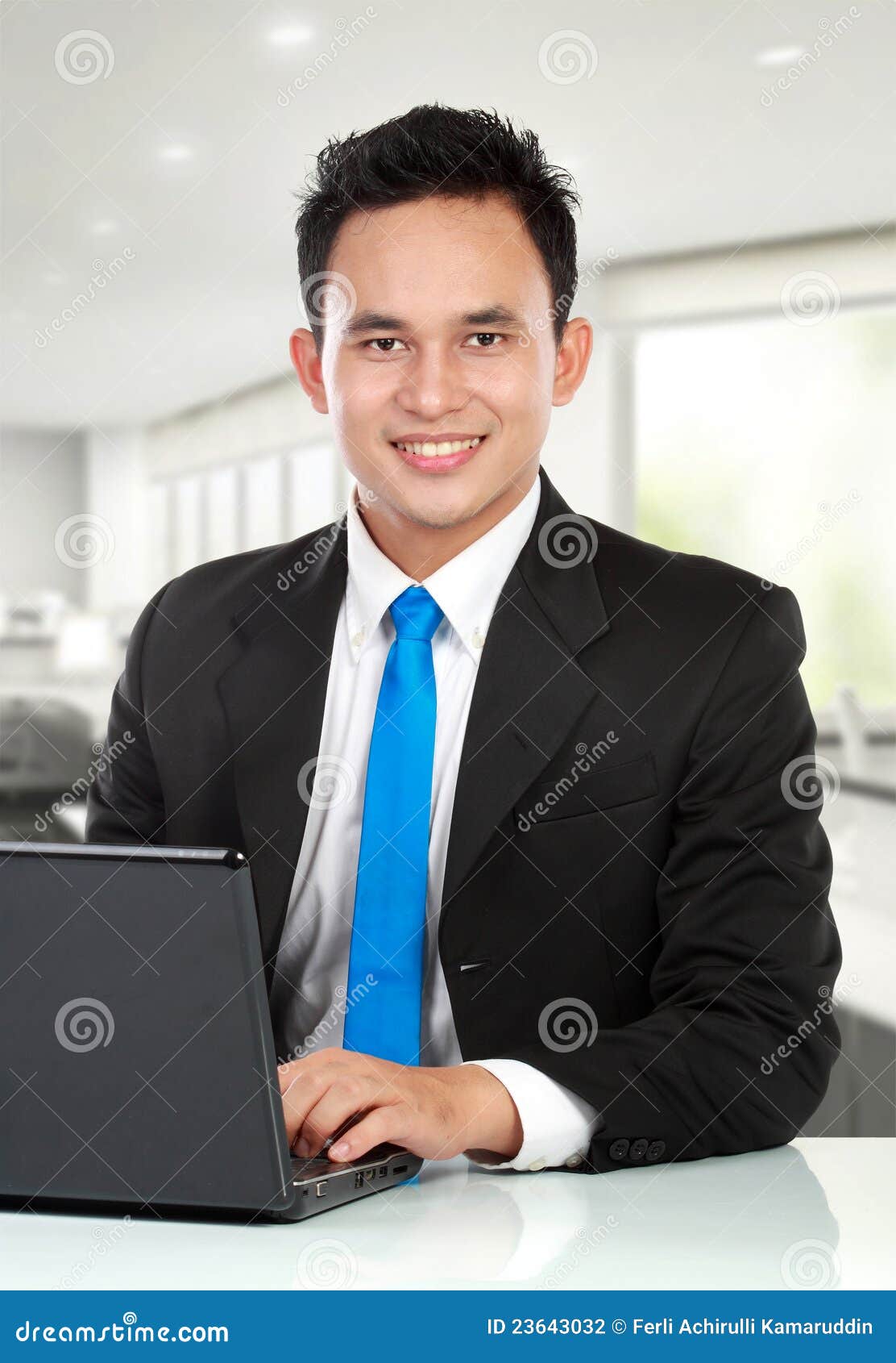 Young Business Man with a Laptop Stock Photo - Image of male, smile ...