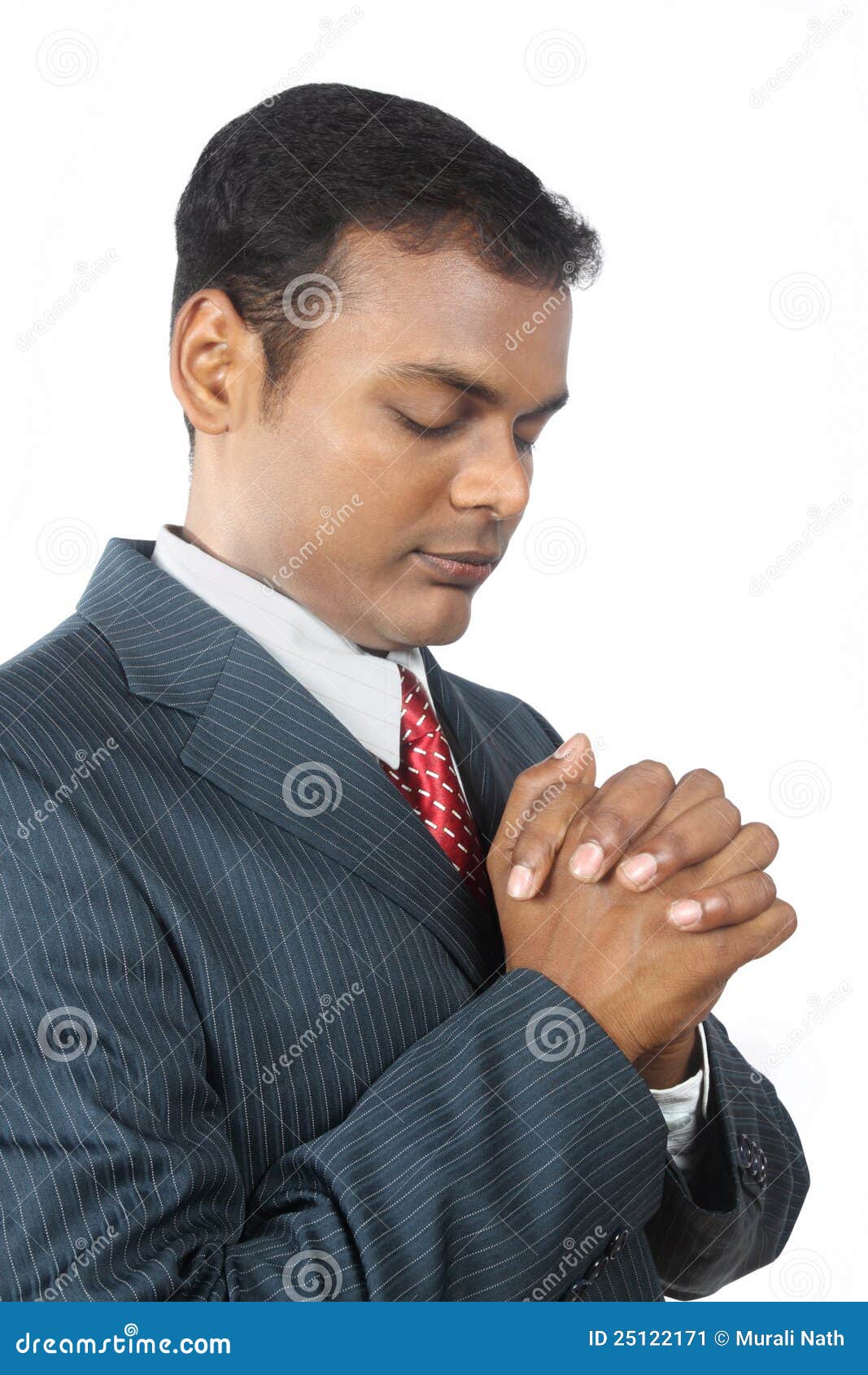 Young Business Man Praying stock image. Image of hands - 25122171