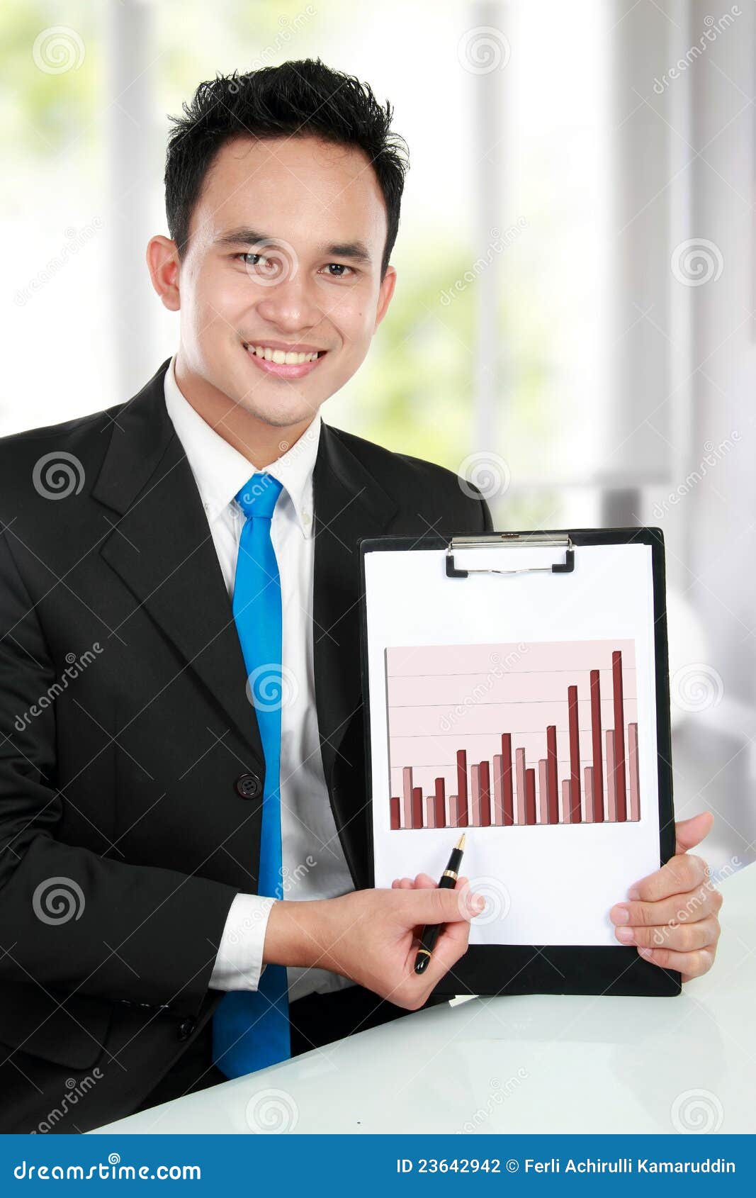 Young Business Man Showing Growth Chart Stock Photo - Image of card ...
