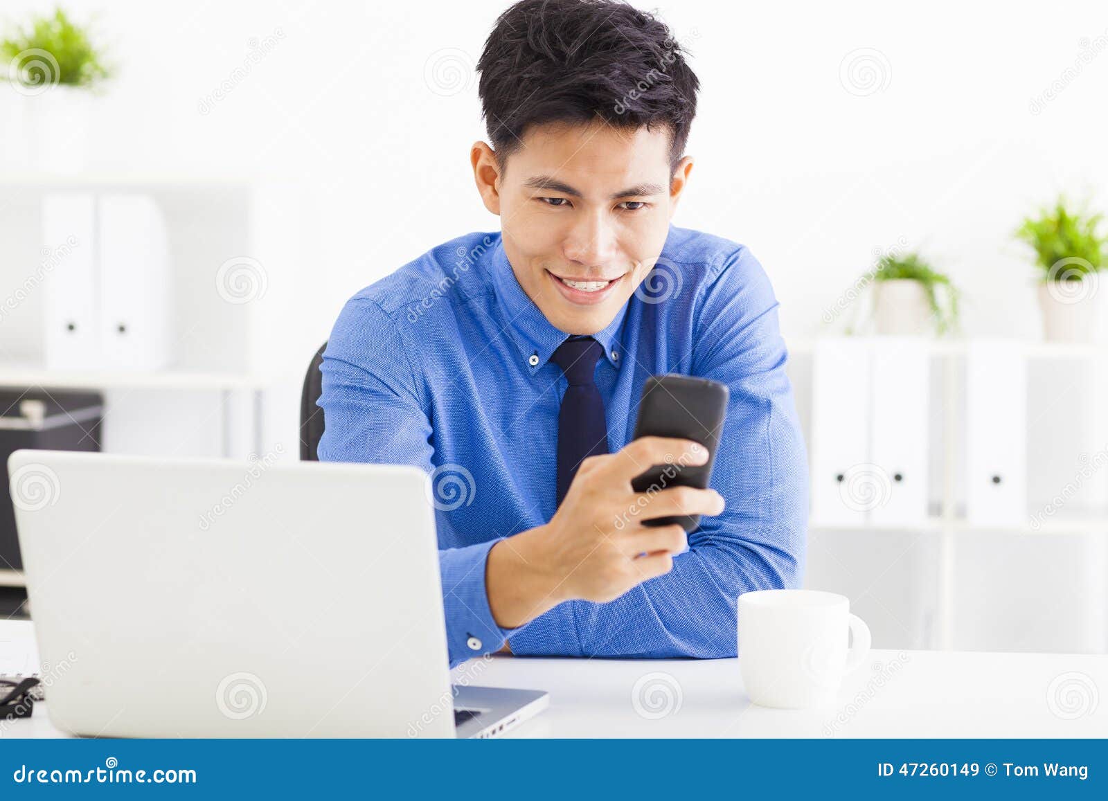 Young Business Man Watching the Smart Phone Stock Image - Image of ...