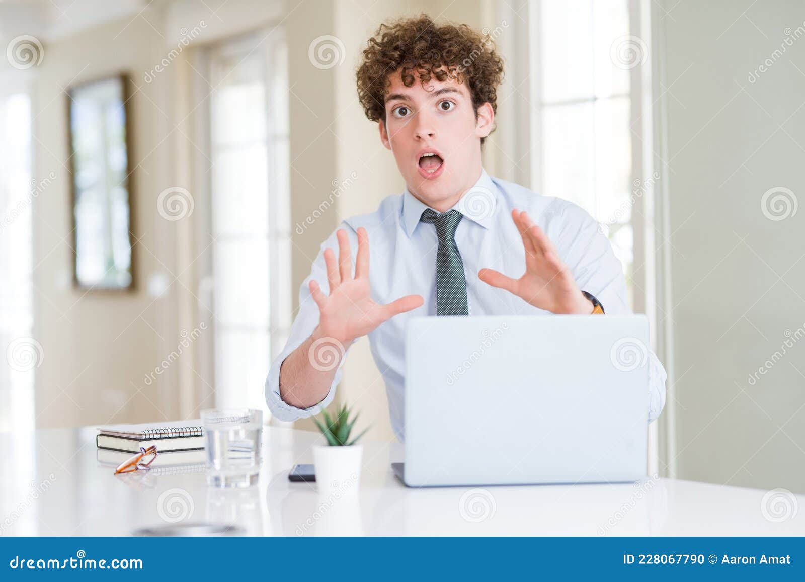 Young Business Man Working with Computer Laptop at the Office Afraid ...