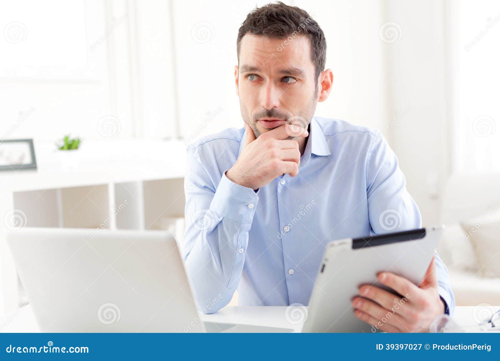 Young Business Man Working at Home on His Tablet Stock Image - Image of ...
