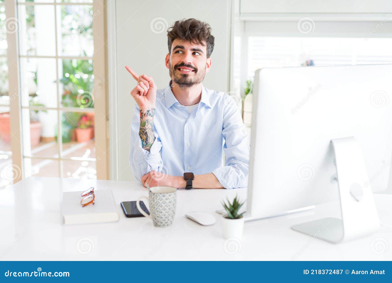 Young Business Man Working Using Computer with a Big Smile on Face ...