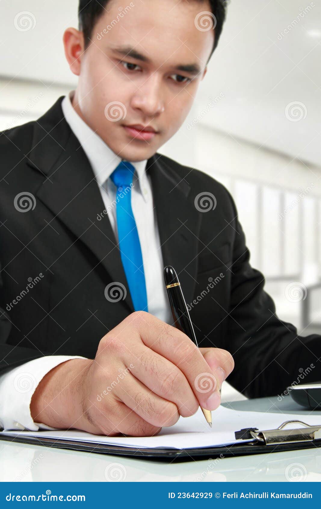 Young business man writing stock image. Image of paper - 23642929