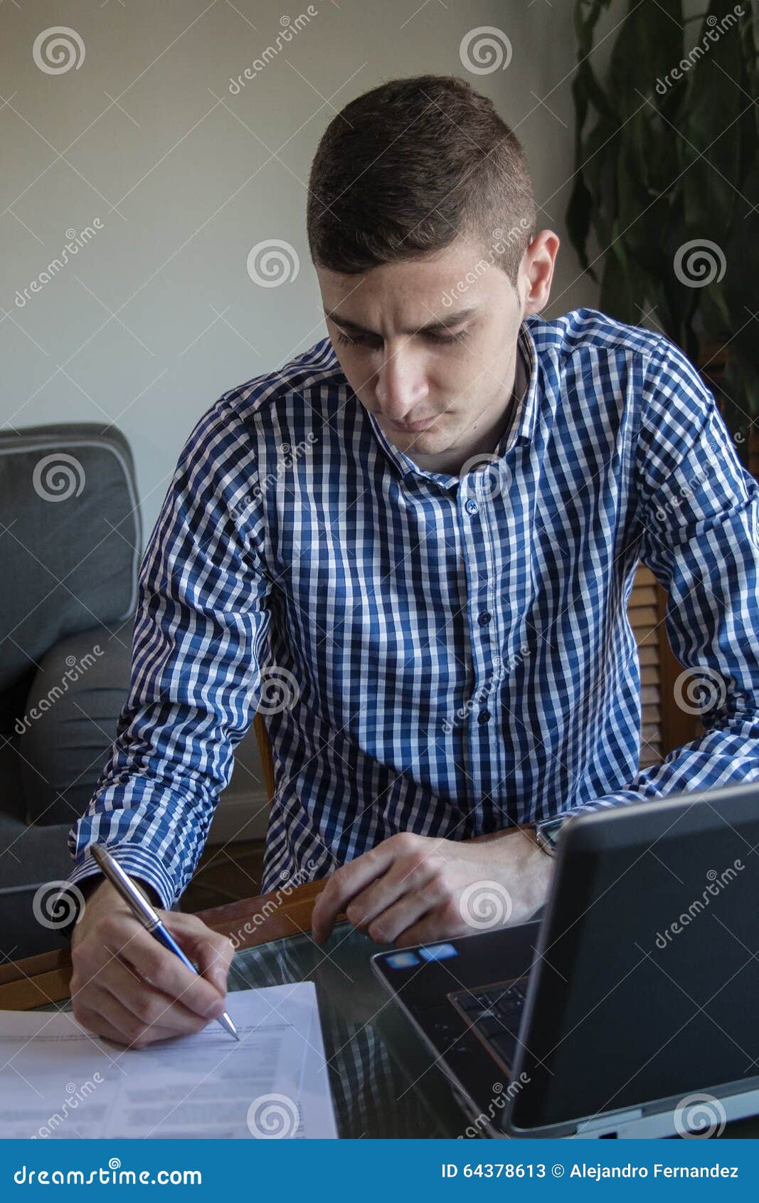 Young Business Man Writing on Paper at Home Office Stock Image - Image ...