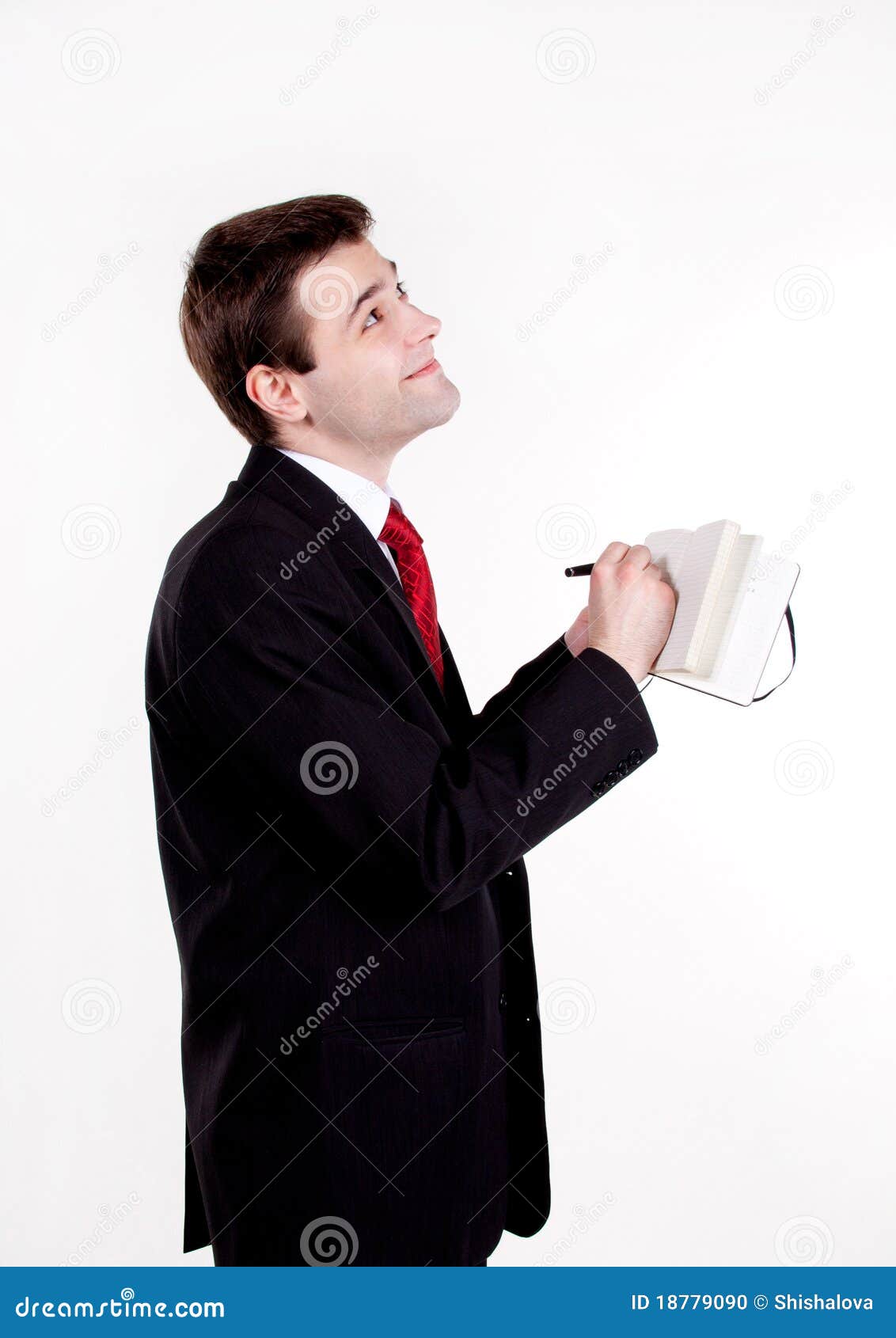 Young Business Man Writing Something in Notebook Stock Photo - Image of ...