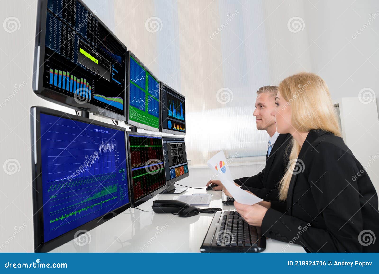 Business People Analyzing Data Displayed on Computer Screens Stock ...