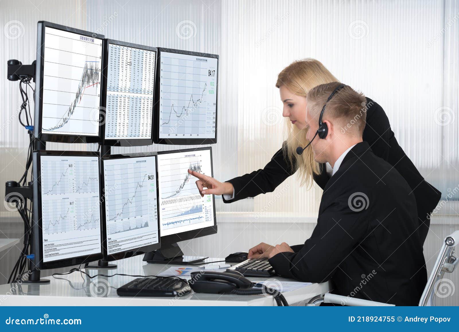 Business People Analyzing Data Displayed on Computer Screens Stock ...