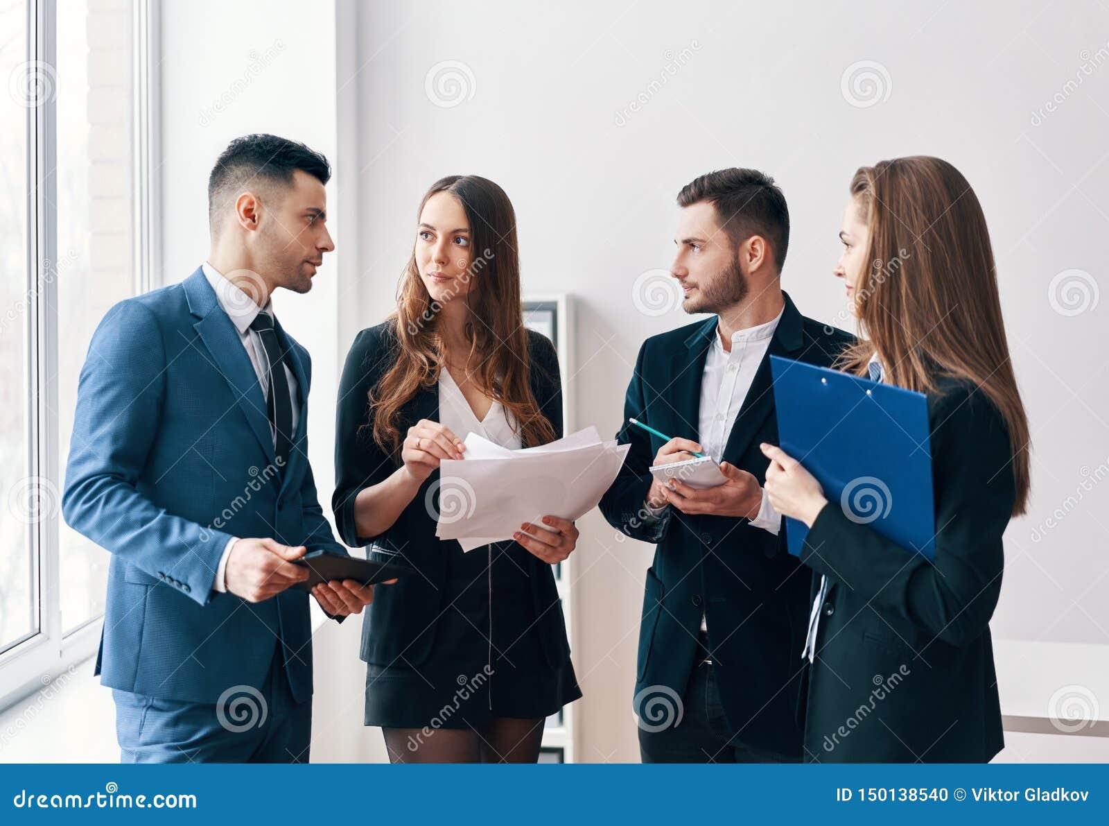 Young Business People Discussing New Business Project in Office Stock ...