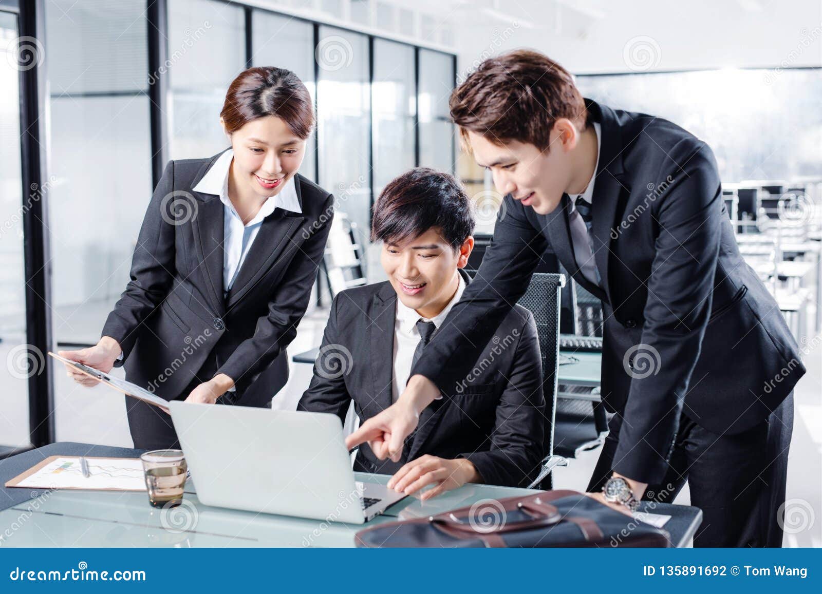 Young Business People Discussing in Office Stock Photo - Image of ...