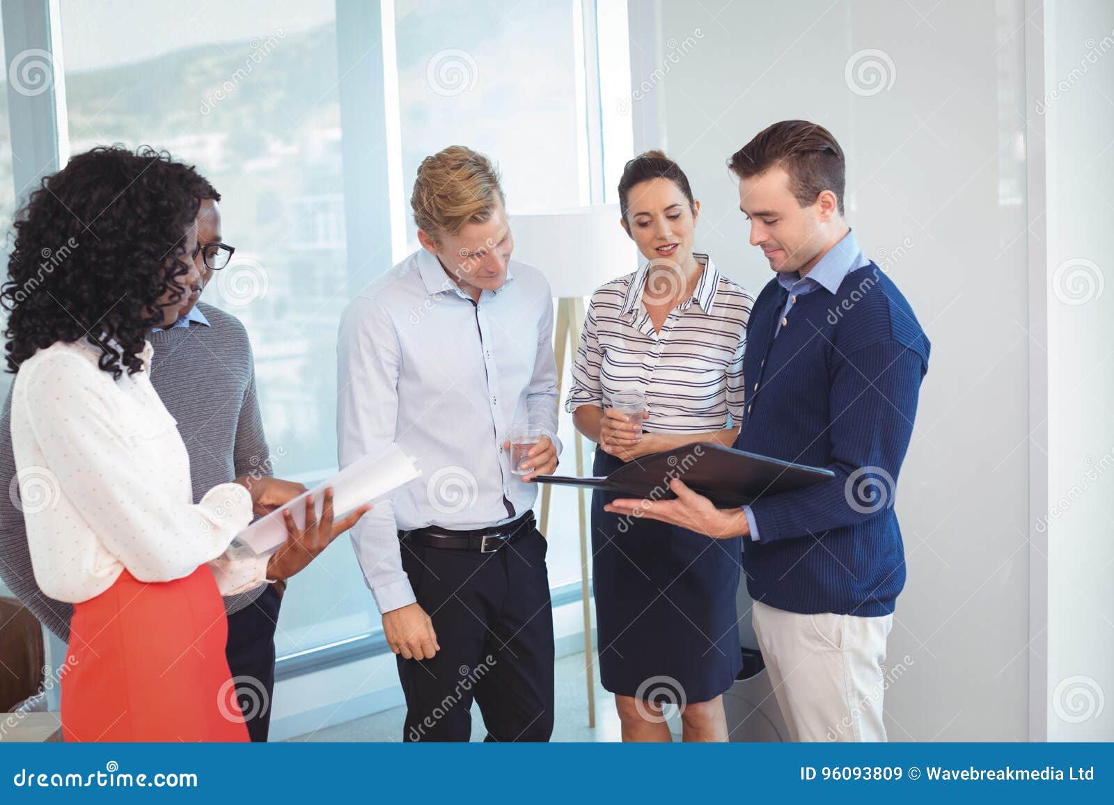 Young Business People Discussing in Office Stock Image - Image of ...