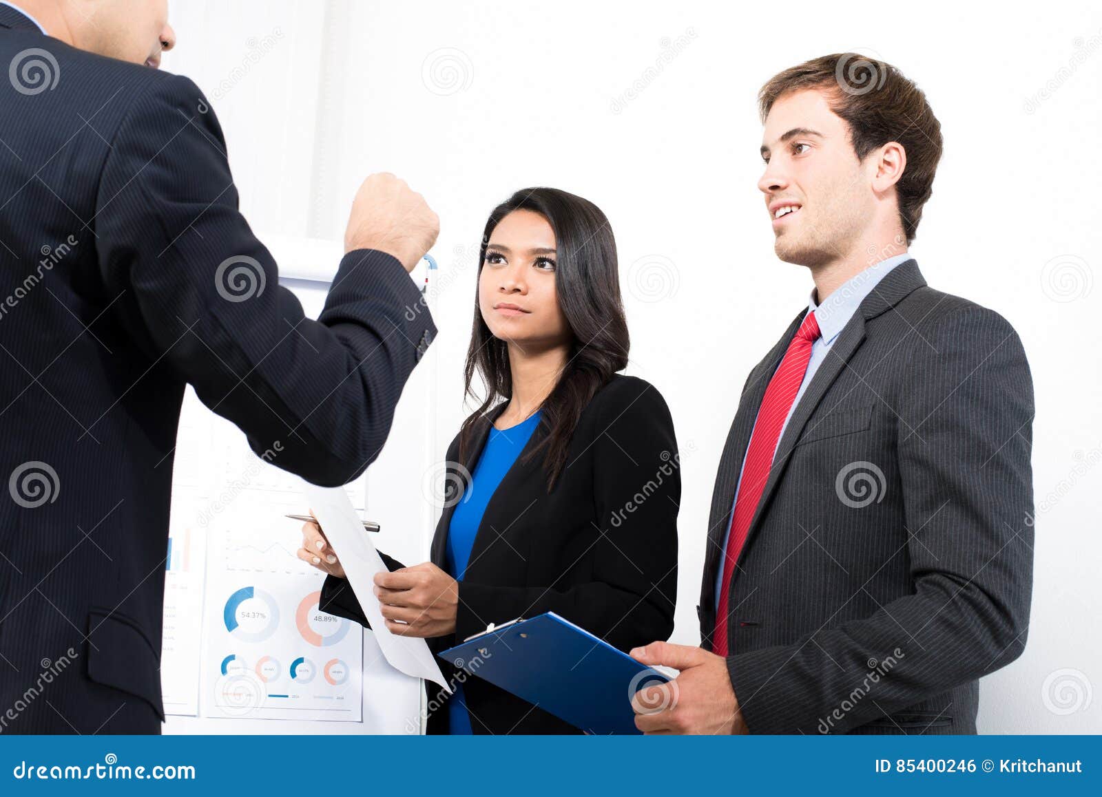 Young Business People Discussing Presenting Work Stock Photo - Image of ...