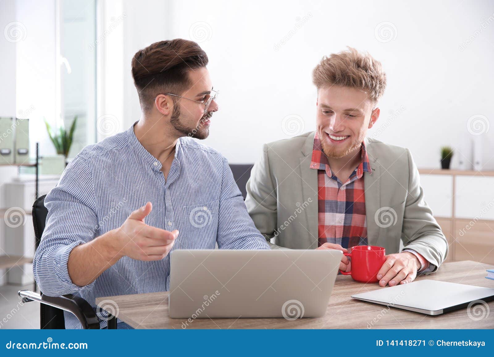 Young Business People Discussing Work Matters in Office. Stock Image ...