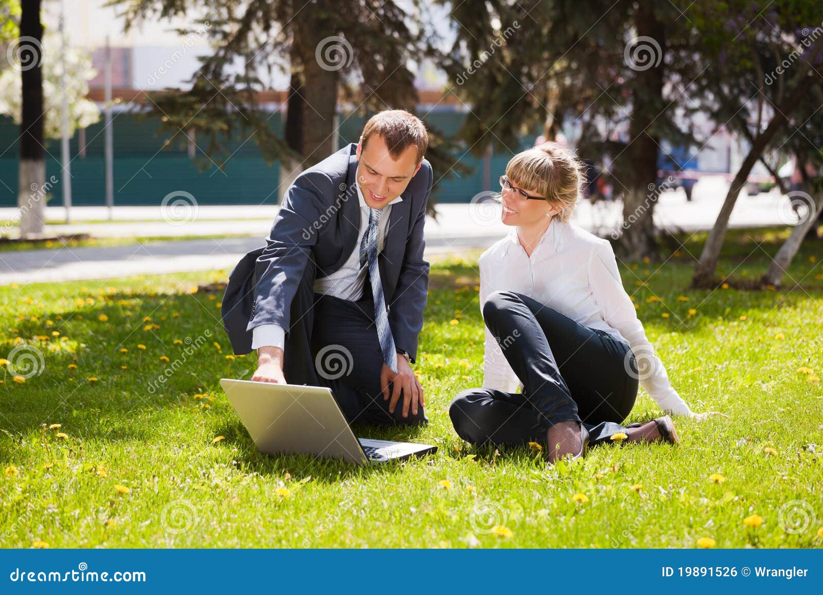 Young Business People Using Laptop in City Park Stock Photo - Image of ...