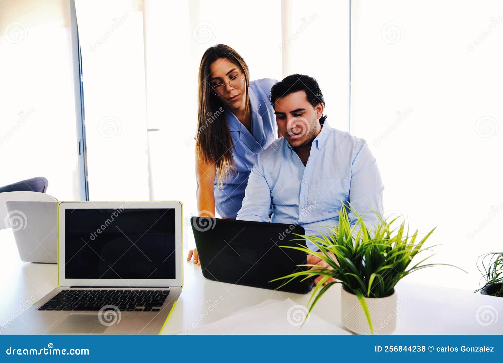 Young Business People Looking at Screen Stock Photo - Image of ...