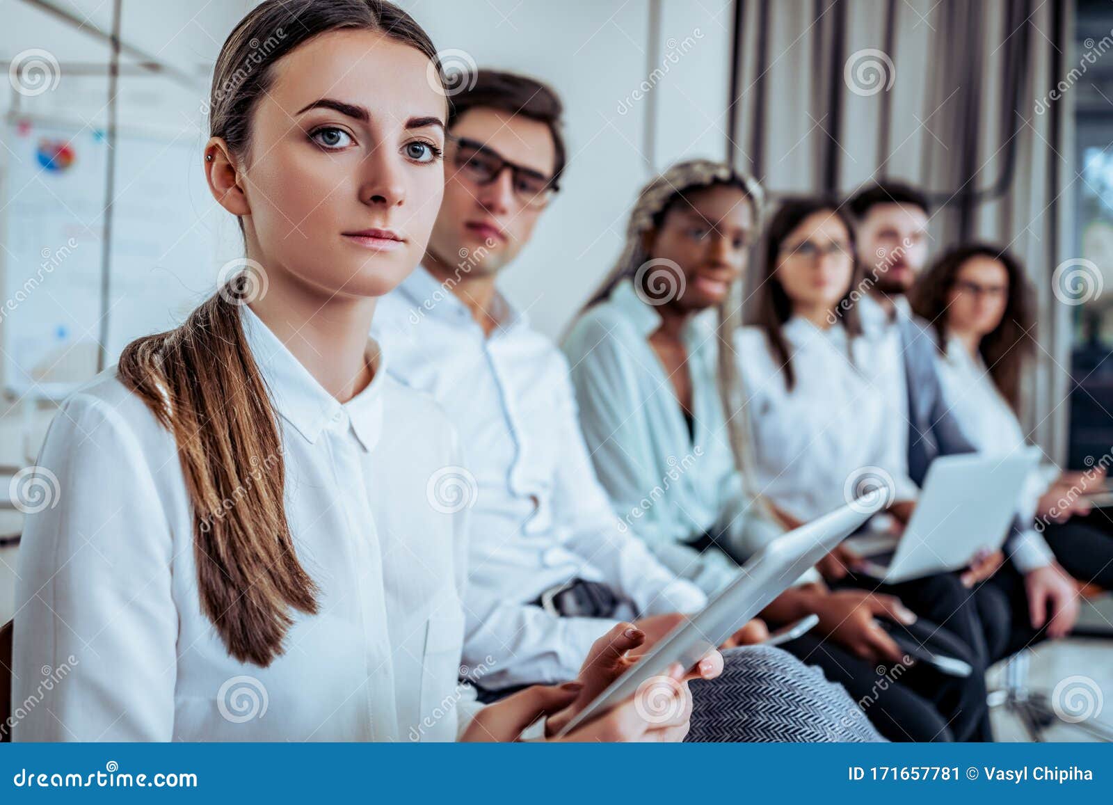 Young Business People. Multinational Team at the Presentation Sits and ...