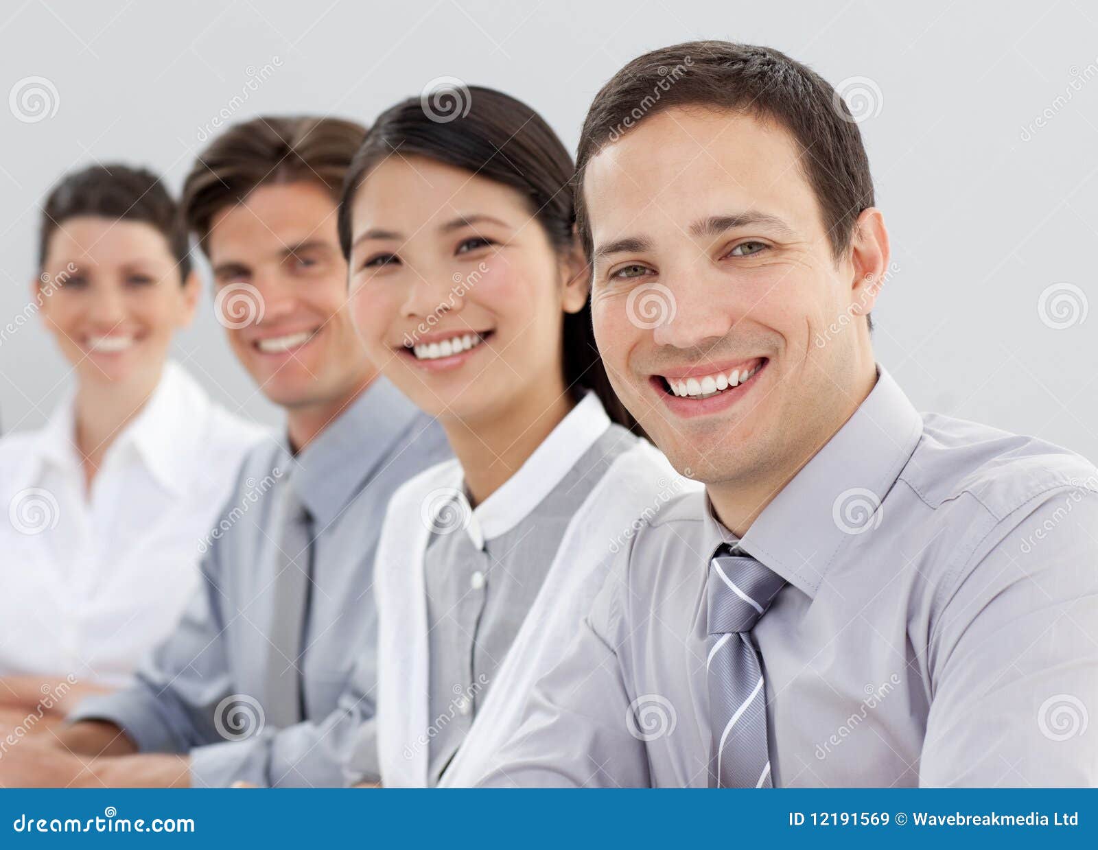 Young Business People Sitting in a Line Stock Image - Image of ...