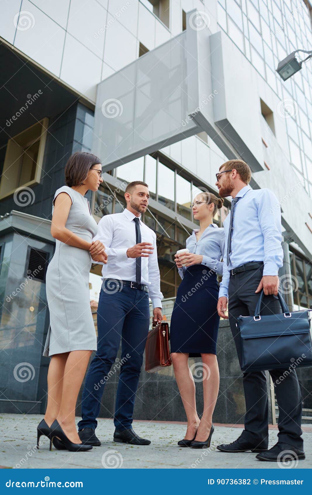 Young Business People Talking by Modern Office Building Stock Photo ...