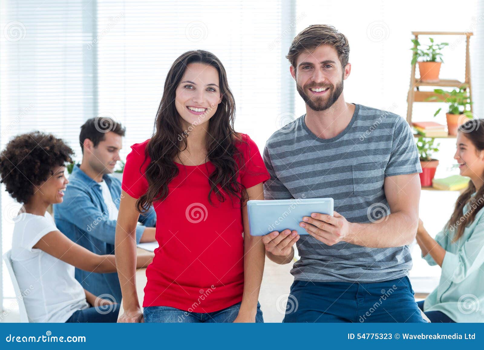 Young Business People Using a Tablet Stock Image - Image of coworkers ...