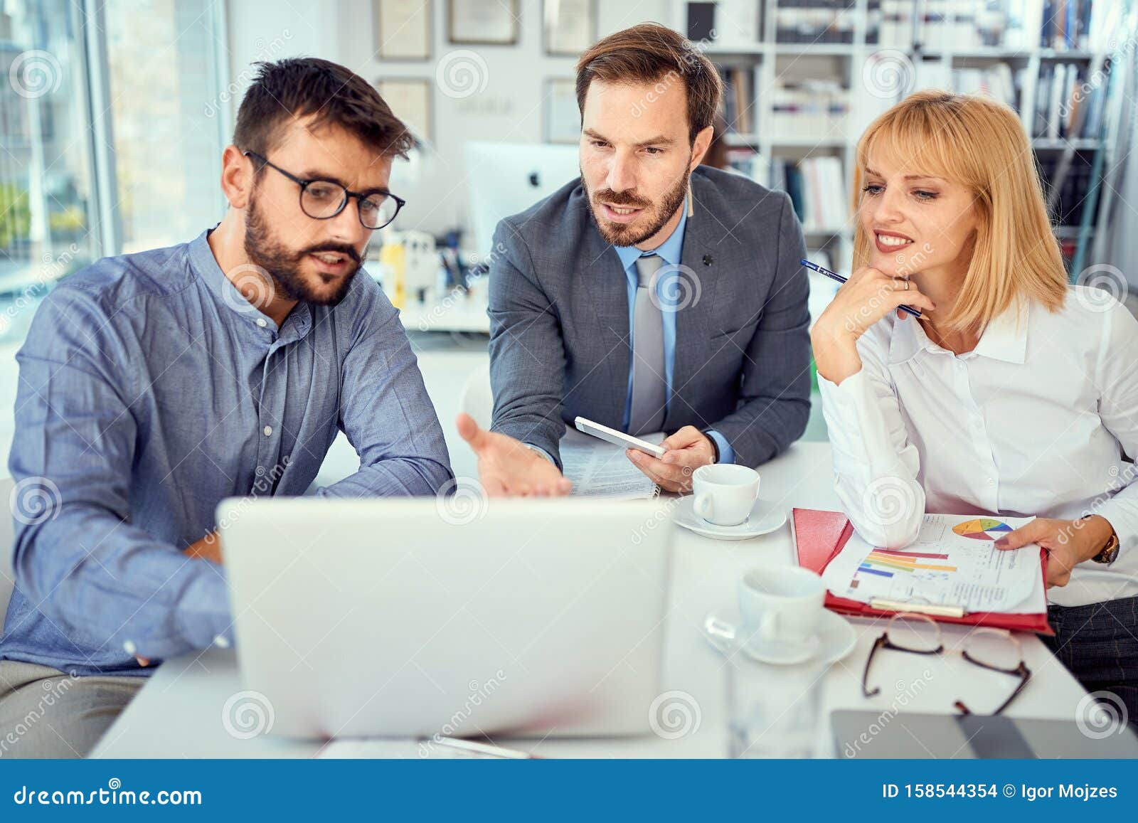 Young Business People Working and Communicating at the Office Stock ...