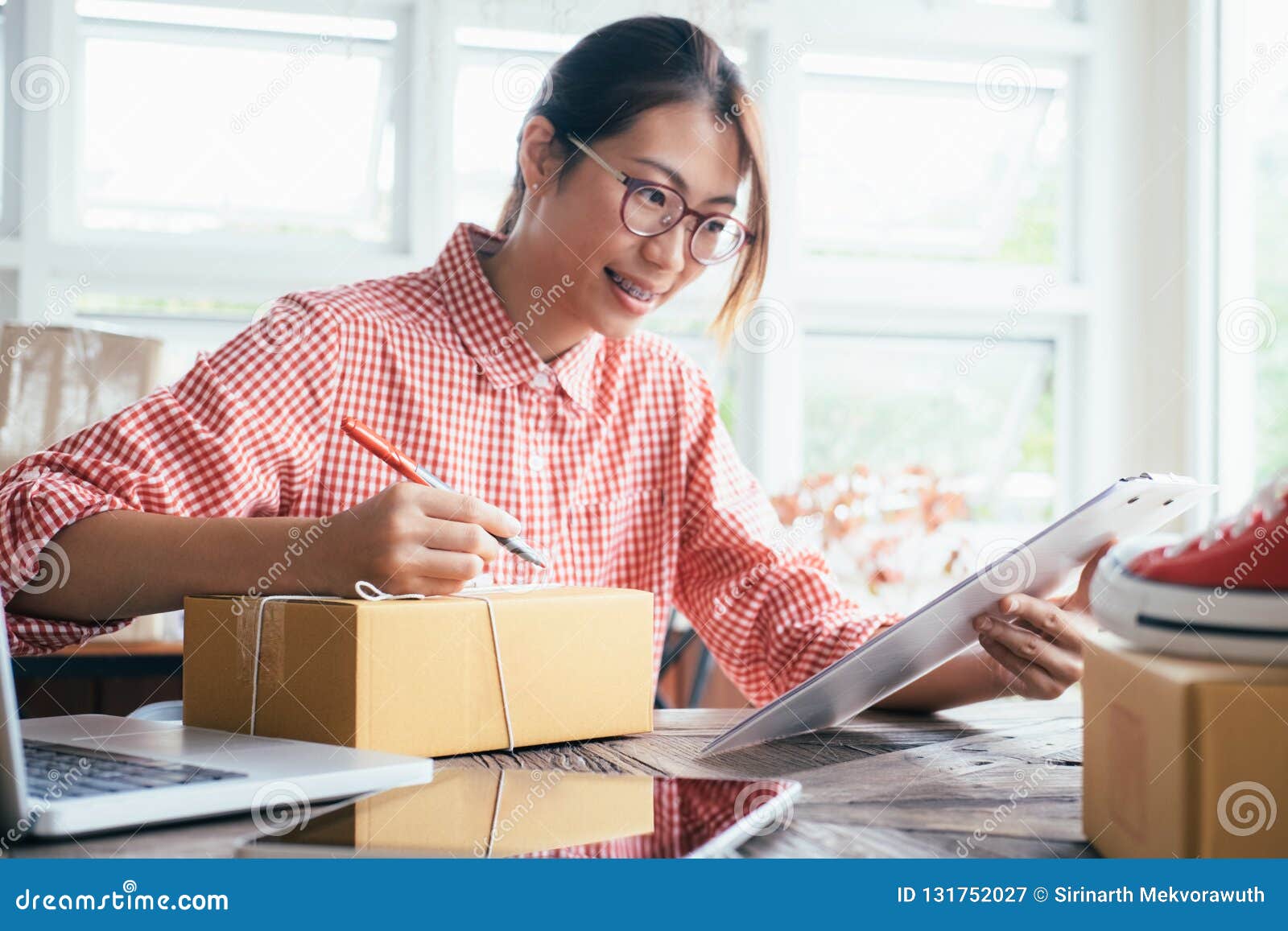 Young Business Start Up Online Seller Owner Using Computer for Checking ...