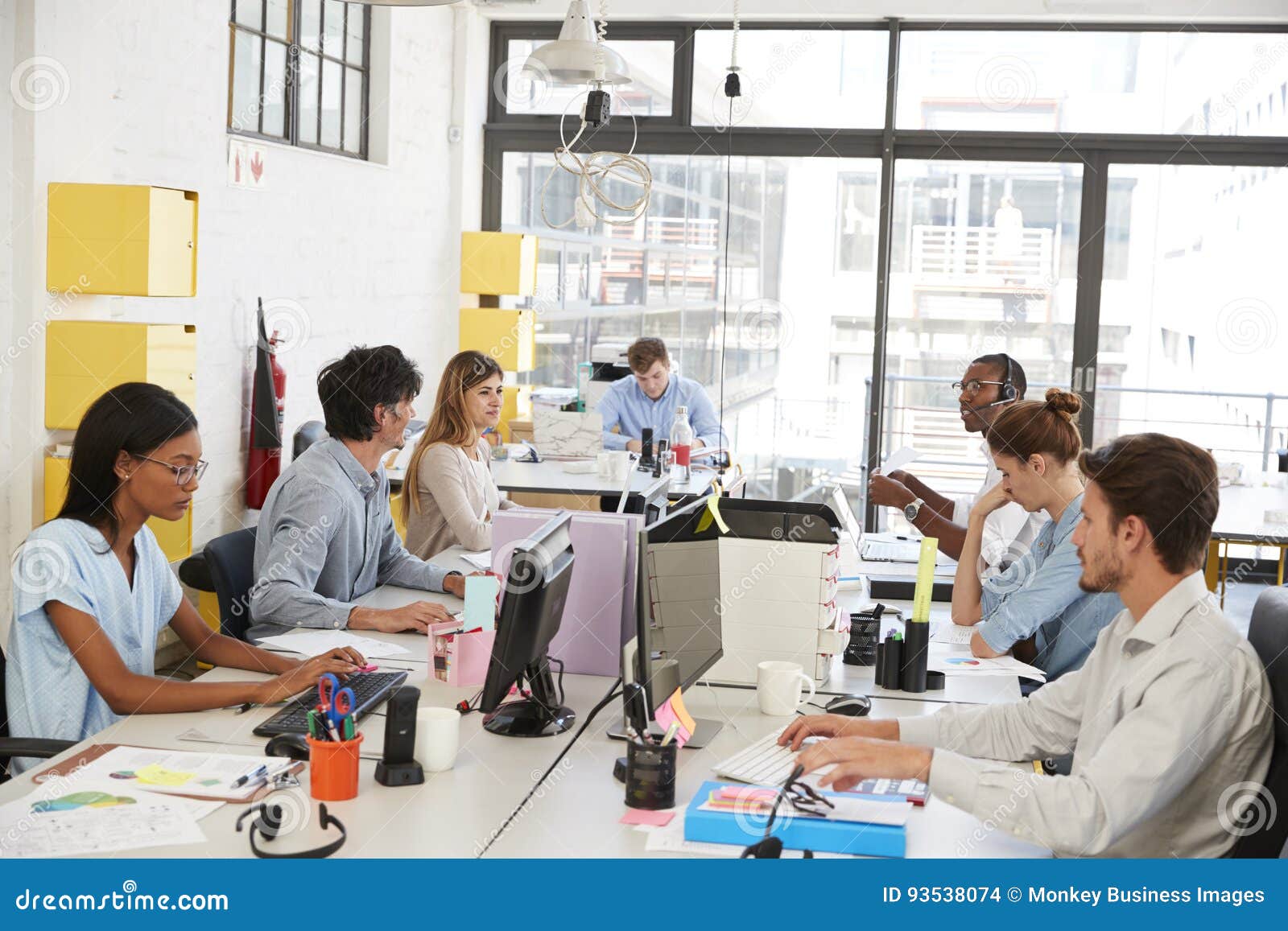 Young Business Team Working in a Busy Open Plan Office Stock Photo ...
