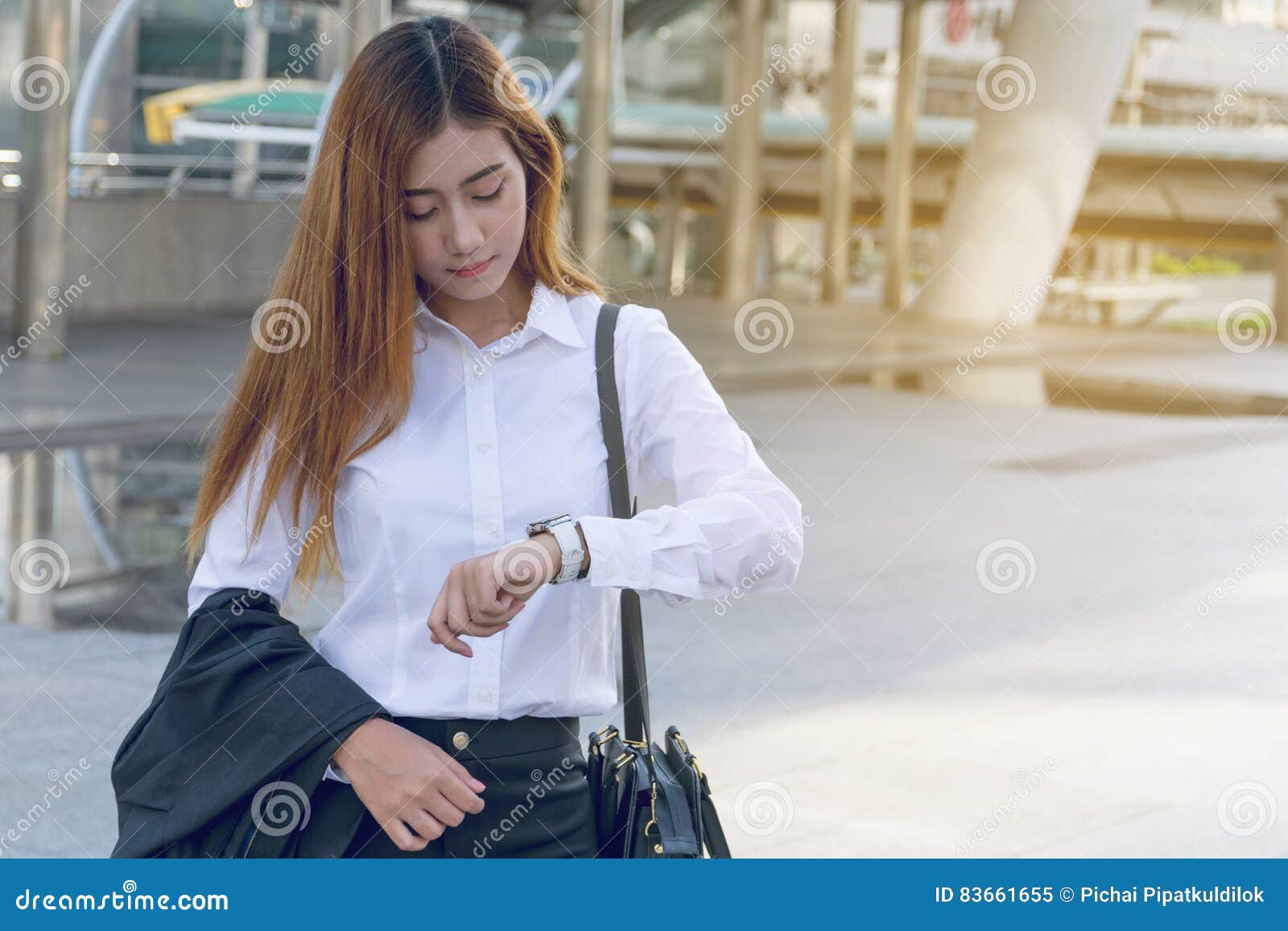 Young Business Woman Checking the Time on Her Watch. Stock Image ...