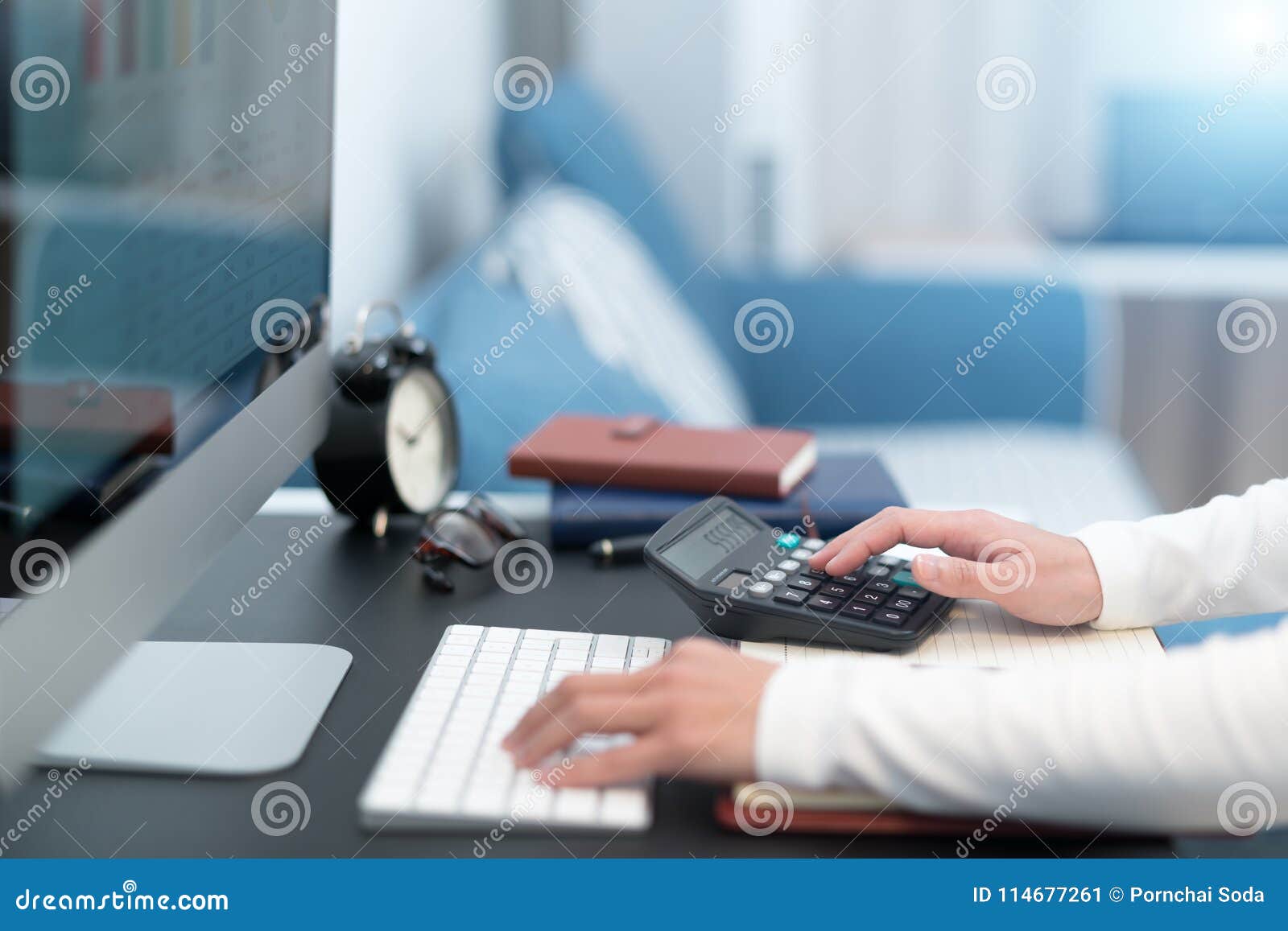 Young Business Women Work with Calculator and Computer Desktop on the ...