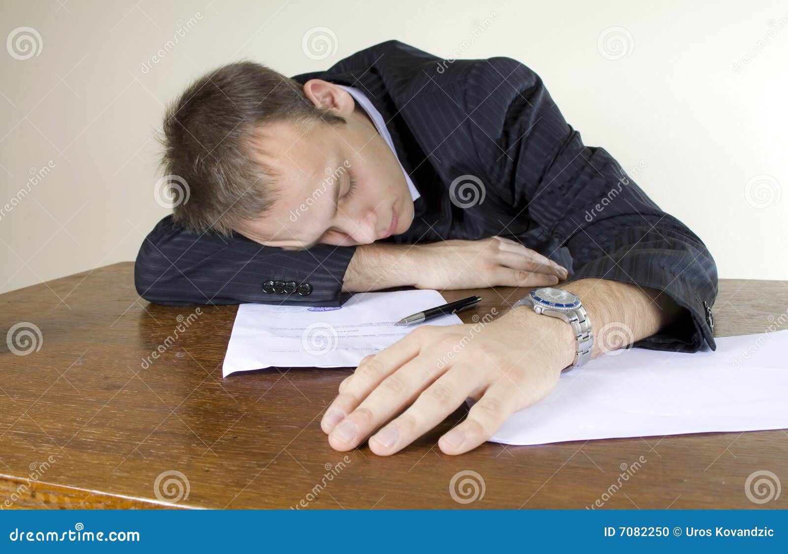 Young Businessman Asleep at His Desk in Office Stock Photo - Image of ...