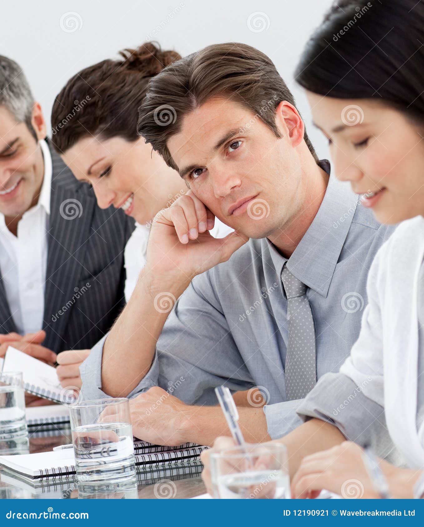 Young Businessman Bored at a Presentation Stock Image - Image of ...