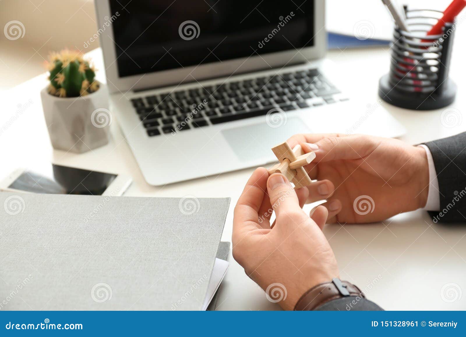 Young Businessman with Brain Teaser at Table in Office Stock Image ...