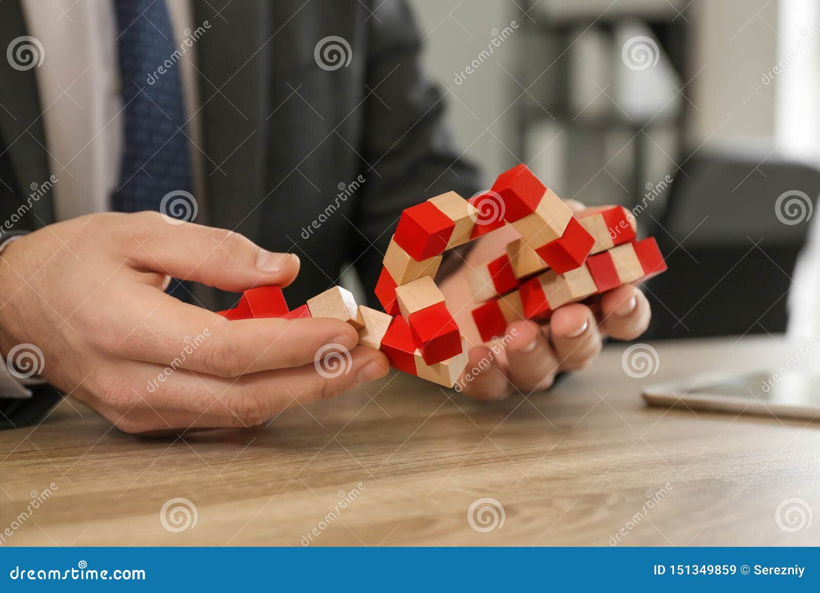 Young Businessman with Brain Teaser at Table in Office Stock Image ...