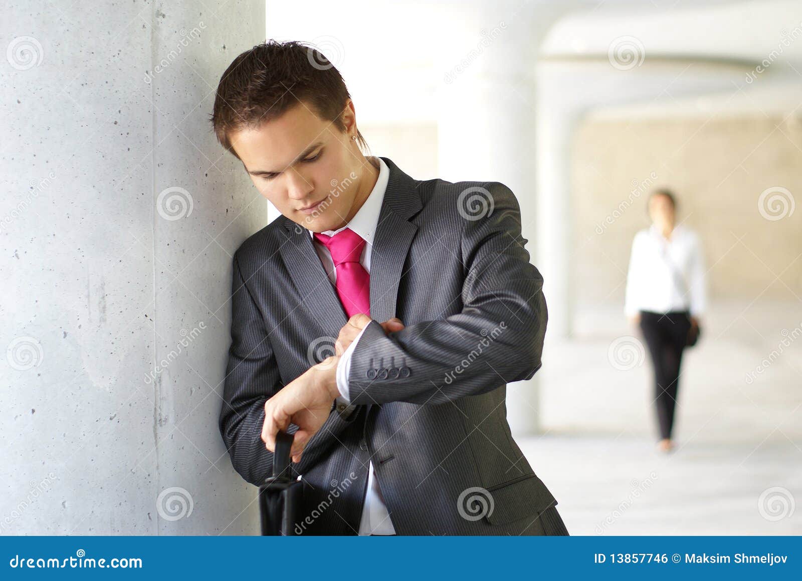 Young Businessman Checking The Time Stock Photo - Image of couple ...