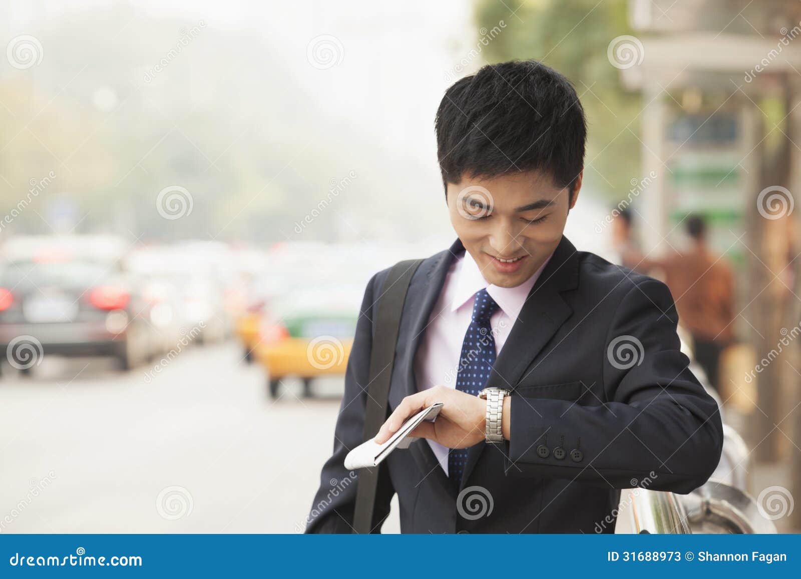 Young Businessman Checking the Time, Waiting for the Bus Stock Image ...