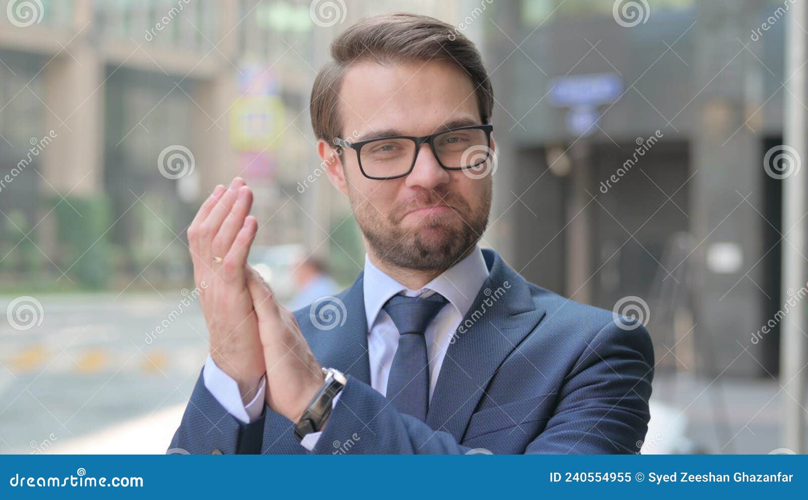 Young Businessman Clapping while Standing Outside Stock Image - Image ...