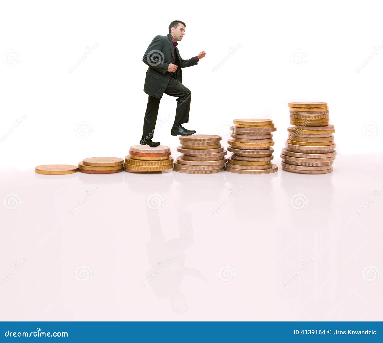 Young Businessman Climbing the Steps Made of Coins Stock Photo - Image ...