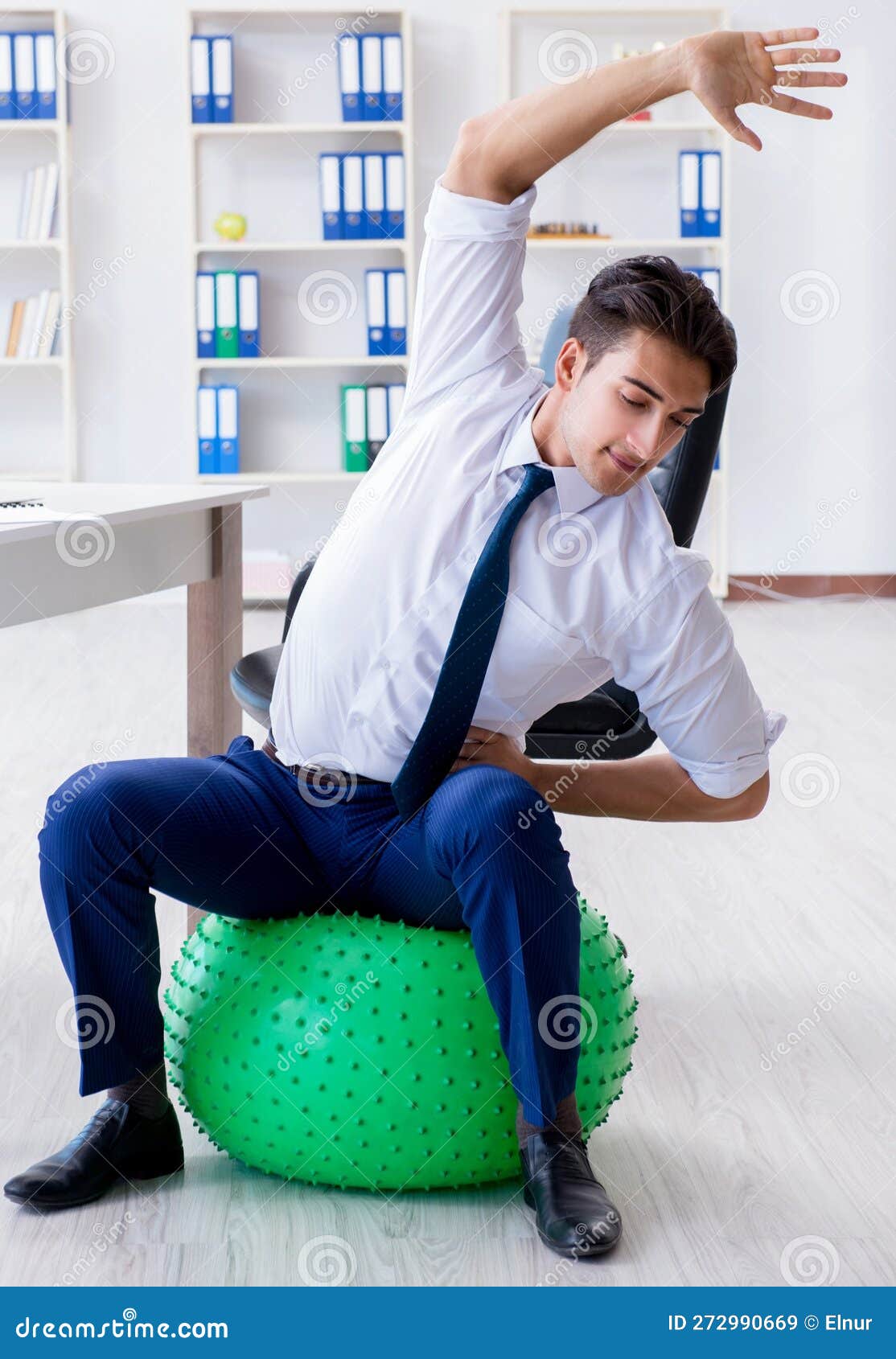 Young Businessman Doing Sports Stretching at Workplace Stock Image ...