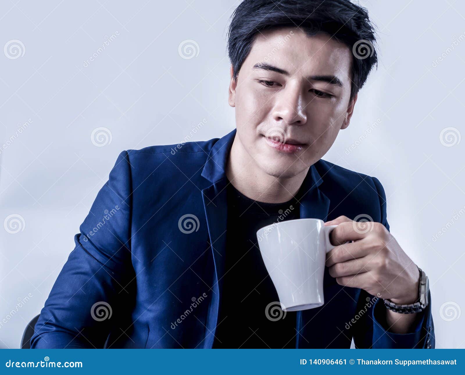 Young Businessman Drinking Coffee Thinking of a Project in Meeting Room ...