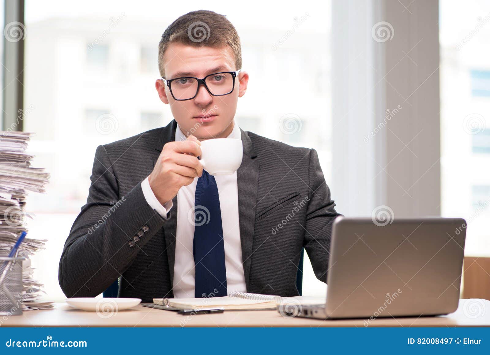 The Young Businessman Drinking Tea in the Office Stock Image - Image of ...