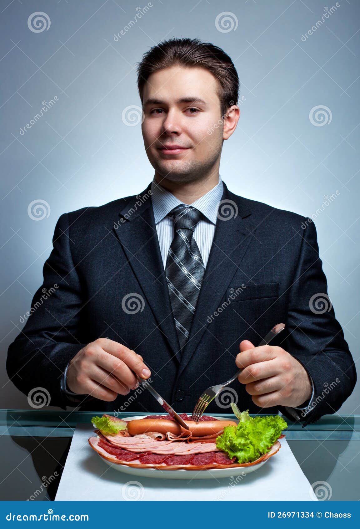 Young businessman eating stock photo. Image of tasty - 26971334