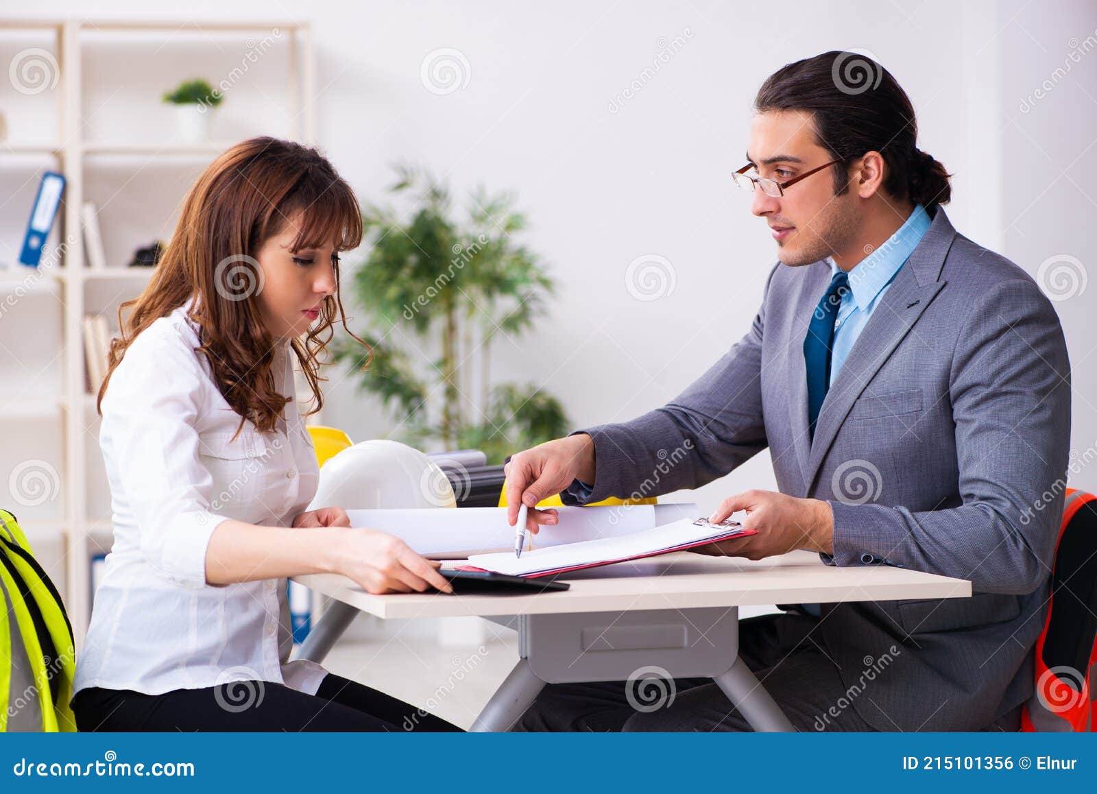 Young Businessman and Female Architect Discussing New Project Stock ...